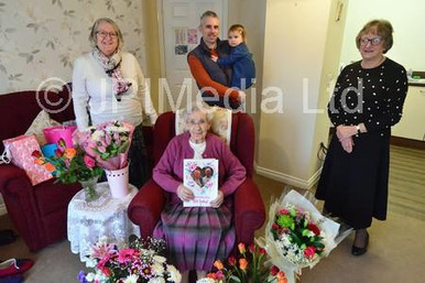 38869119-Nancy Rooks celebrating her 100th Birthday with rear left to ...