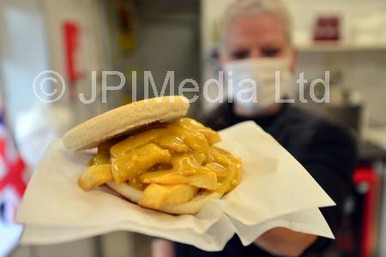 38901266-A curried chip butty ready to be battered at The Hut fish and ...