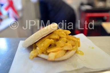 38901267-A curried chip butty ready to be battered at The Hut fish and ...