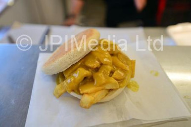 38901268-A curried chip butty ready to be battered at The Hut fish and ...
