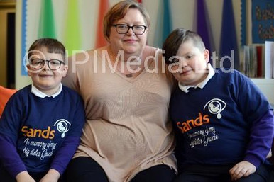 39404227-Brothers Billy, eight and Henry Gibbon, seven with mum Sue ...