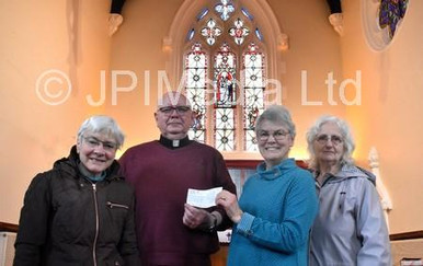 38598777-Father Tom McGovern with church members Frances Levett, Ann ...
