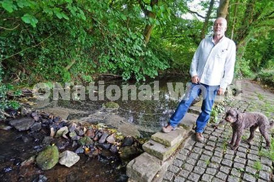 39522549-Polluted river Amber at Ashover. Seen local resident Mick ...