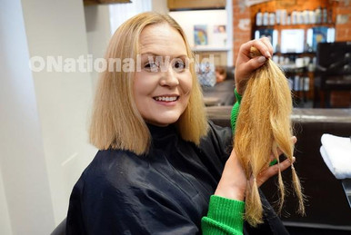 39657176-Katie Baxter having her hair cut for Little Princess Charity ...