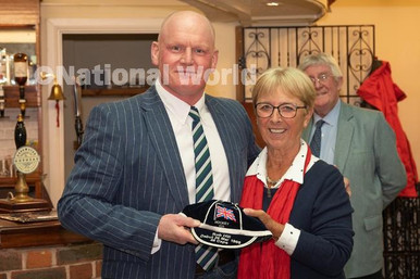 39678170-Pictured is: Rob Hill receives his GB cap from Sheila Monroe ...