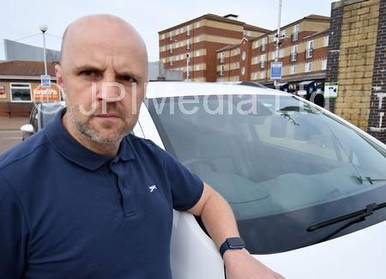 39425593-David Snowdon 42 at his car close to the a parking meter pay ...