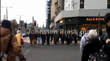 29545645-Video grabs of Nash Riggins crossing Princes Street and ...