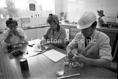 20378646-Members of the Qulaity Control department tasting sweets, jam ...