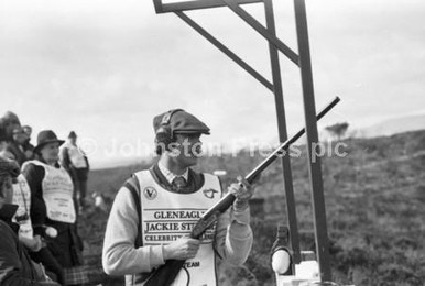 20379058-Prince Edward gets his shotgun ready at the Gleneagles hotel ...