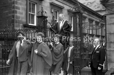 20379257-A porter looks on as Scottish sports commentator Archie ...