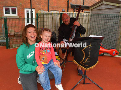 39836955-Harper Guy and her mum Amanda pictured with the Cello Fella ...