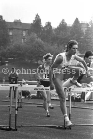 20379494-Pat Rollo on her way to winning the Women s 100m hurdles race ...