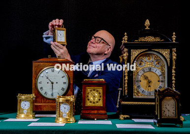 39867370-Simon Frodsham with clocks made by his famous clockmaking ...
