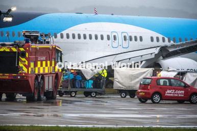 39879159-Baggage unloaded from a Tui plane which has slipped off the ...