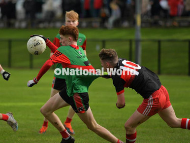 39882884-Anthony McGill of Kilrea gets a grip on Doire Trasna’s Conor O ...