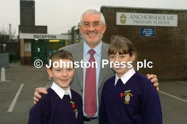 21402520-Headteacher Mike Bryan with head boy Ben Rudge and head girl ...