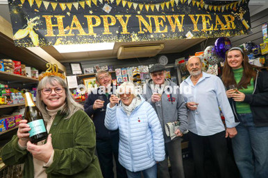 39914484-From left, newsagent Jo Durham, then customers Mike Bennett ...