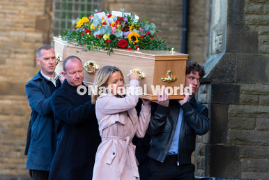 39928306-Pall bearers carry the coffin of Mandy Laird-Hall, who taught ...
