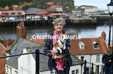 39928990-Whitby harbour. Pictured Sue Boyce, with her dog Charlie. 13h ...
