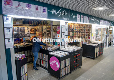 39949623-Customers search for classic tunes in Spin It Records owned by ...