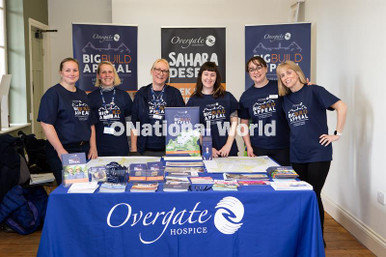 39960003-Team from Overgate Hospice showing plans and fundraising for ...