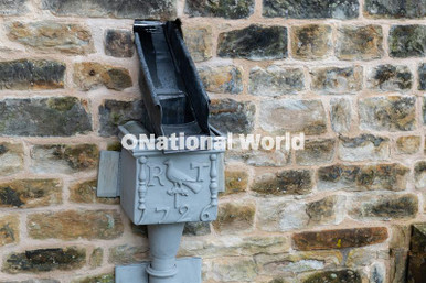 39970033-Guttering at the top of Towneley Hall reveals the initials RT ...