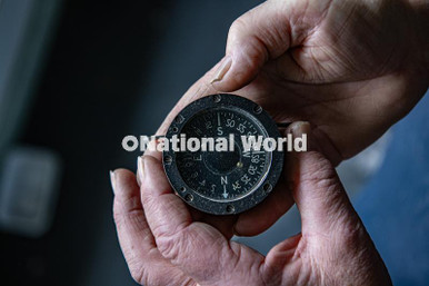 39978219-A compass made during WWII in the hands of compass maker Brian ...