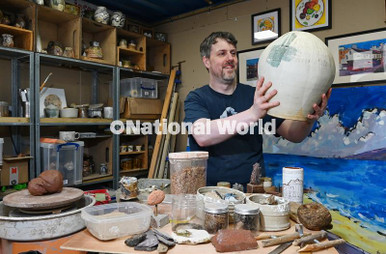 39985844-Artist Joseph Travis in his studio, a converted shipping ...