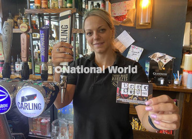 40031419-Sherrell Roberts with the loyalty card in he three Brass ...