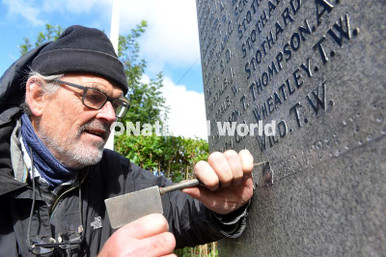 40034983-Stone carver and letter cutter David Edwick adding extra names ...