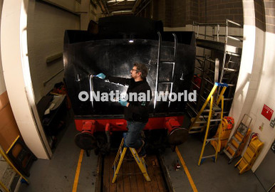 40074756-Senior Conservator Dean Smith working on the Q1 tender ...