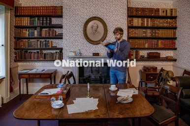 40088956-Staff member Ethan Hutchinson along with team members busy ...