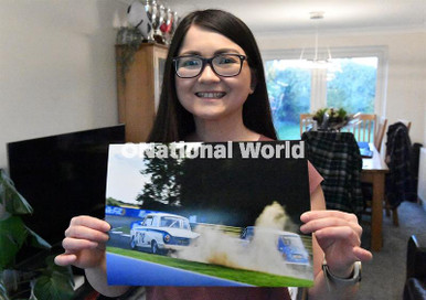 40102754-Photographer Nikki Sim holds one of her action photographs ...