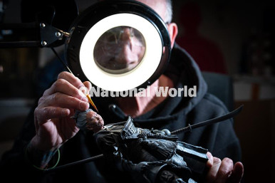 40106382-Gary MacMillan paints one of his models, Gary specialises in ...