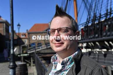 40257576-Simon Bishop strikes a pose at the Historic Quay during a ...