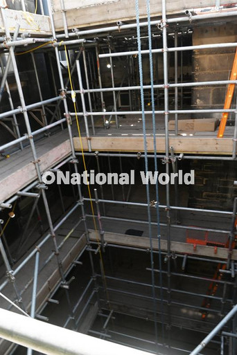 40317205-As work continues inside and outside the building, we take an ...