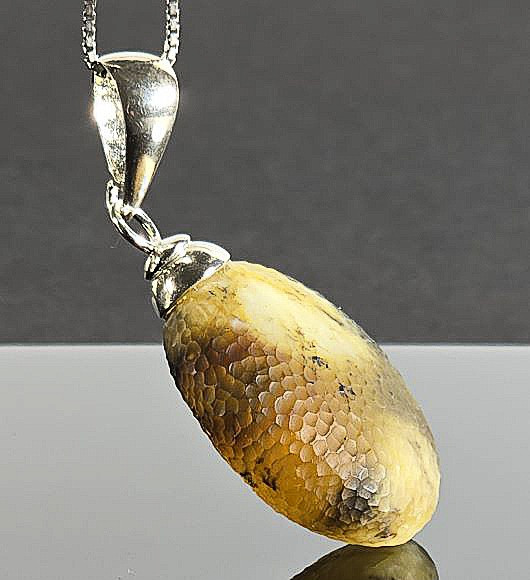 Amber Pendant Made of Carved Cloudy Baltic Amber.