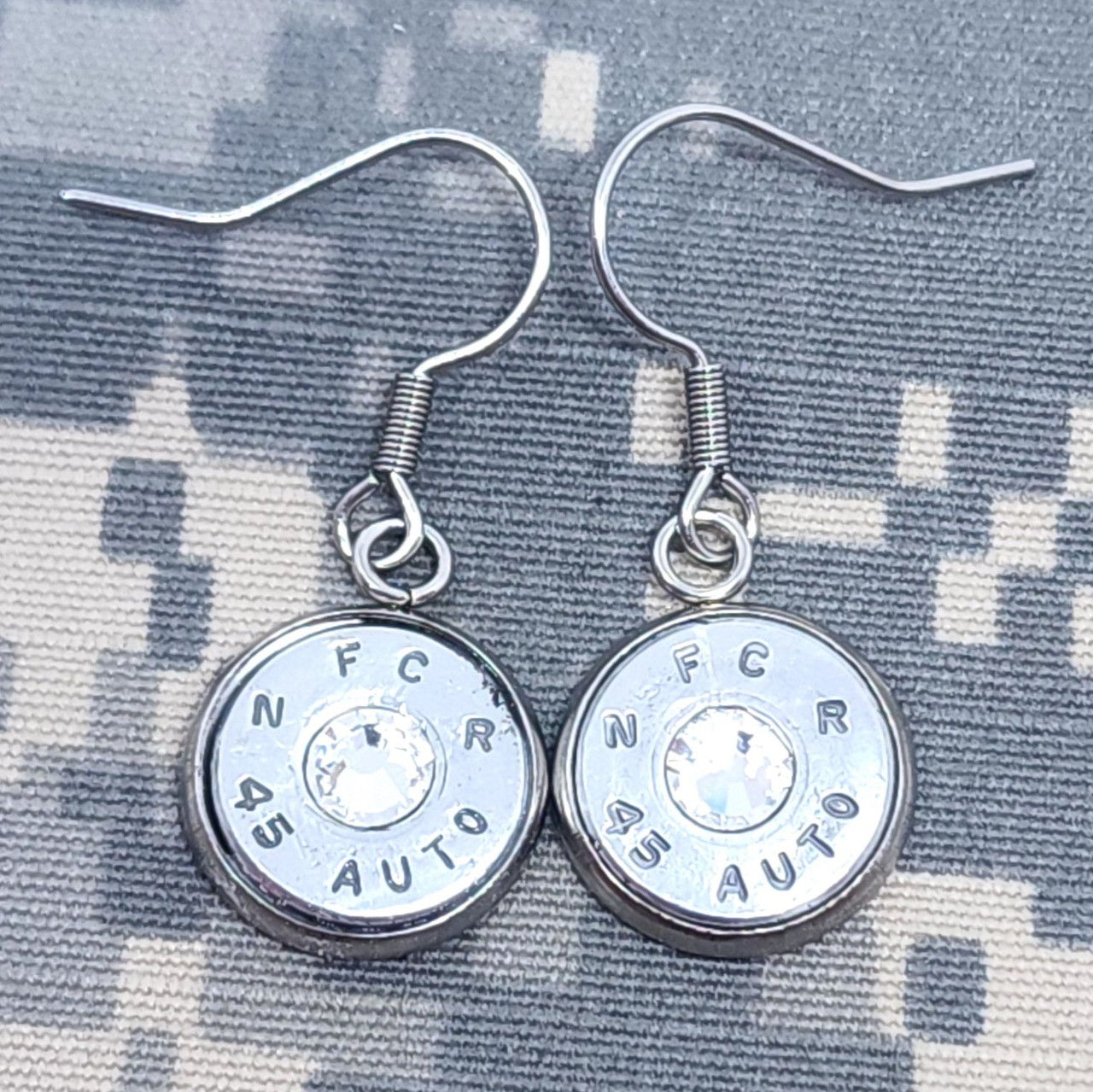 45 Caliber Silver Bullet Casings Clear Crystal Surgical Dangle Earrings ...