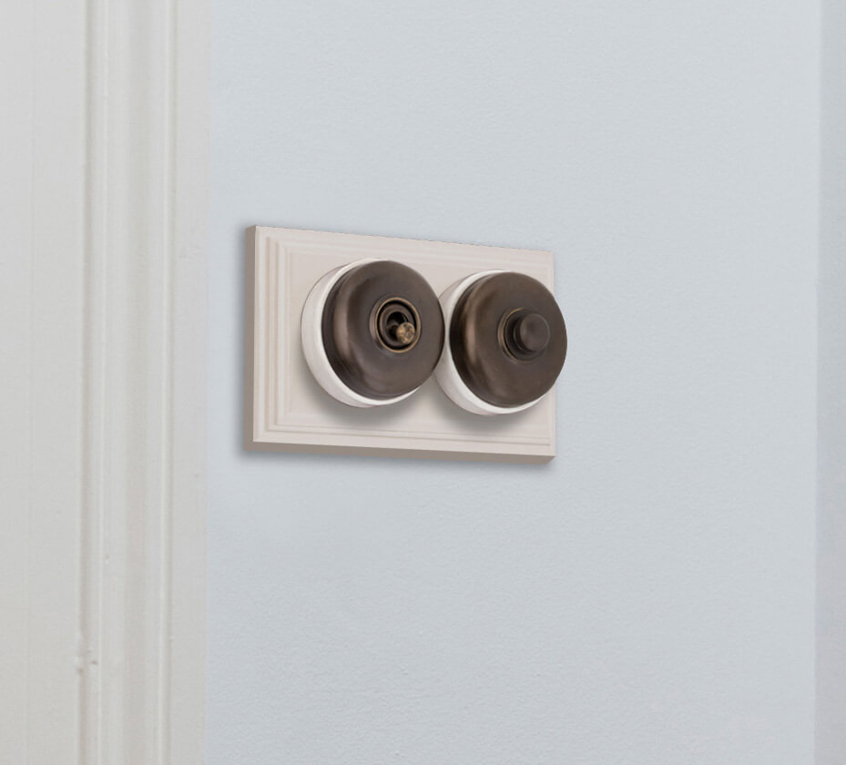 Tradco Ivory Porcelain Base Toggle Light Switch | 60mm | Antique Brass