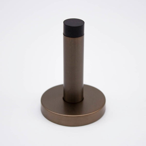 Manovella Straight Wall Mounted Door Stop 75mm | Aged Brass