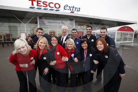 14067682-Staff at St Rollox Tesco celebrate the Tesco multi million ...