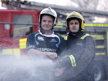 14151835-Glasgow Warriors prop John Welsh pictured with firefighter ...