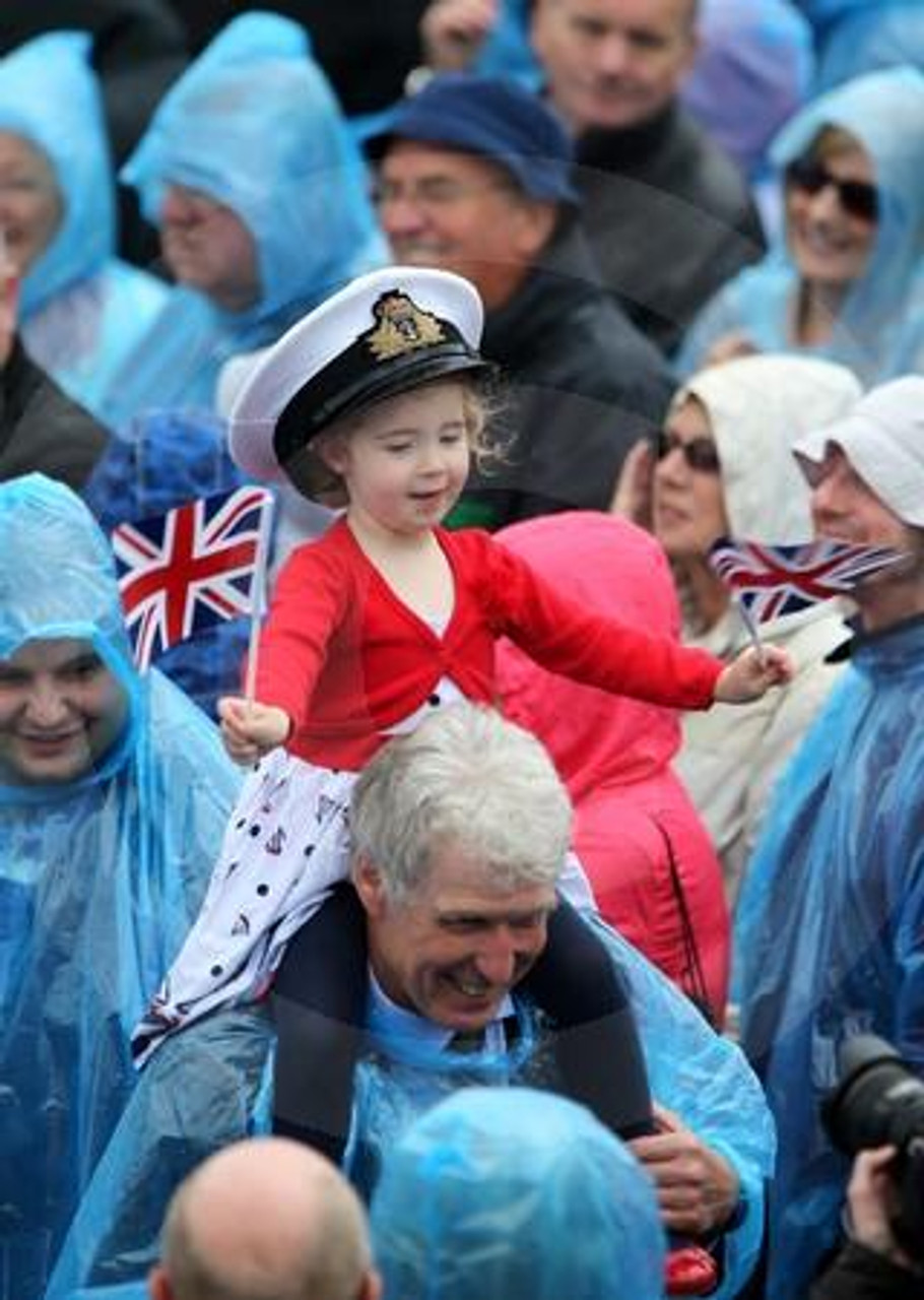 28060361 The Crowds Braved Rain As The Newly Named Aircraft Carrier Hms