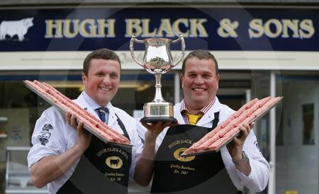 28568035-Hugh Black, left and his brother Craig pictured with the trophy they won for their ...