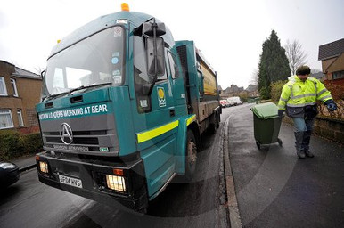 14130663-Glasgow City Council refuse collection now operating at the weekend. Refuse collectors ...