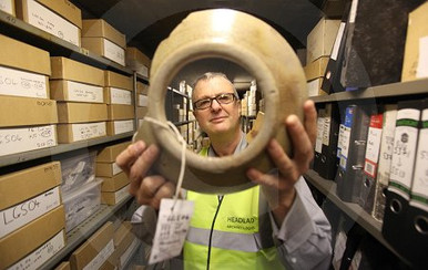14984597-Managing Director Dr Tim Holden with an early 18th century ...