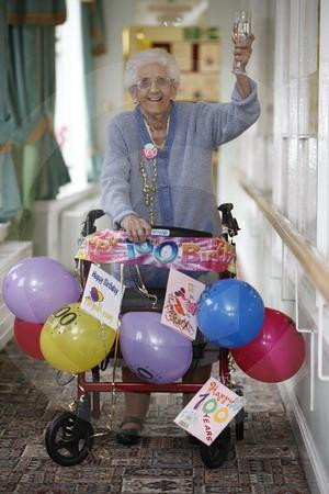 22928397-Jeannie McCallum celebrates her 100th birthday with a glass of ...