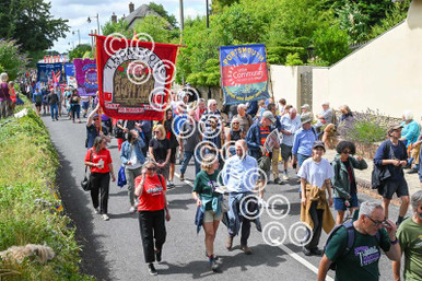 40361157-Unions parade through the village with their banners at the ...