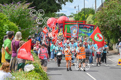 40361123-Unions parade through the village with their banners at the ...