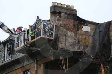 38365443-Pictured are workers from Reigart making a tenement block safe ...
